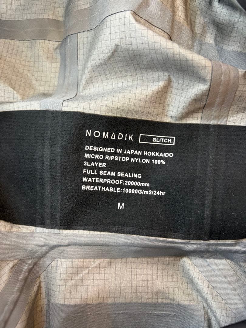 新品 NOMADIK グリッチジャケット　Mサイズ　タグ付送料込み